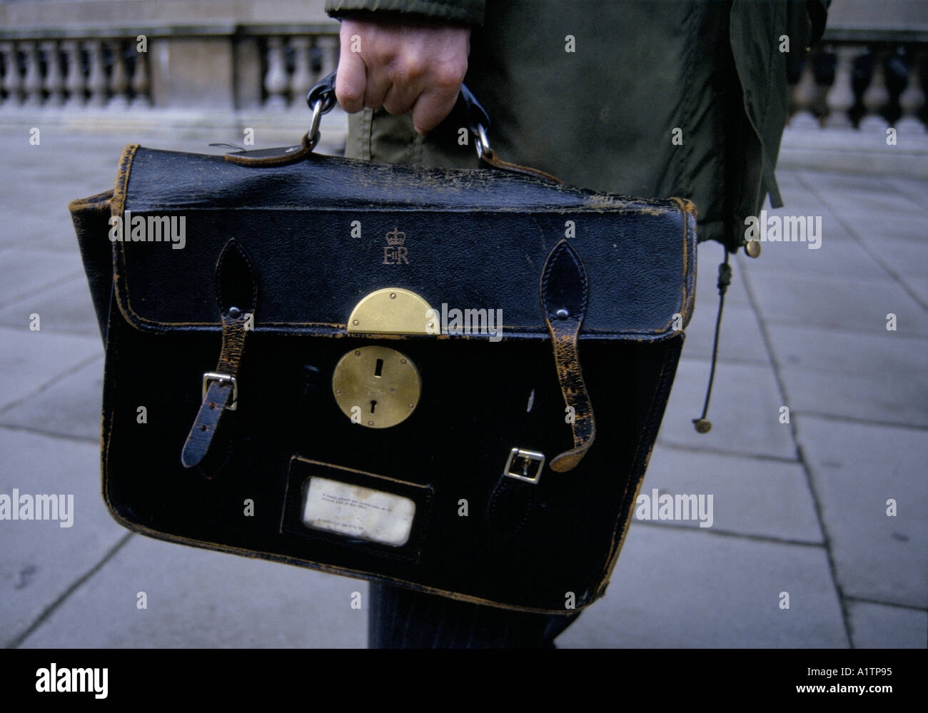 TREASURY OFFICIAL ON WAY HOME WITH BATTERED BRIEFCASE WHITEHALL Stock ...