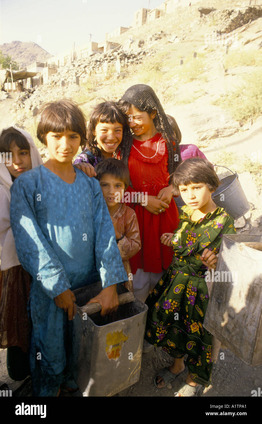 Children collecting water hi-res stock photography and images - Alamy