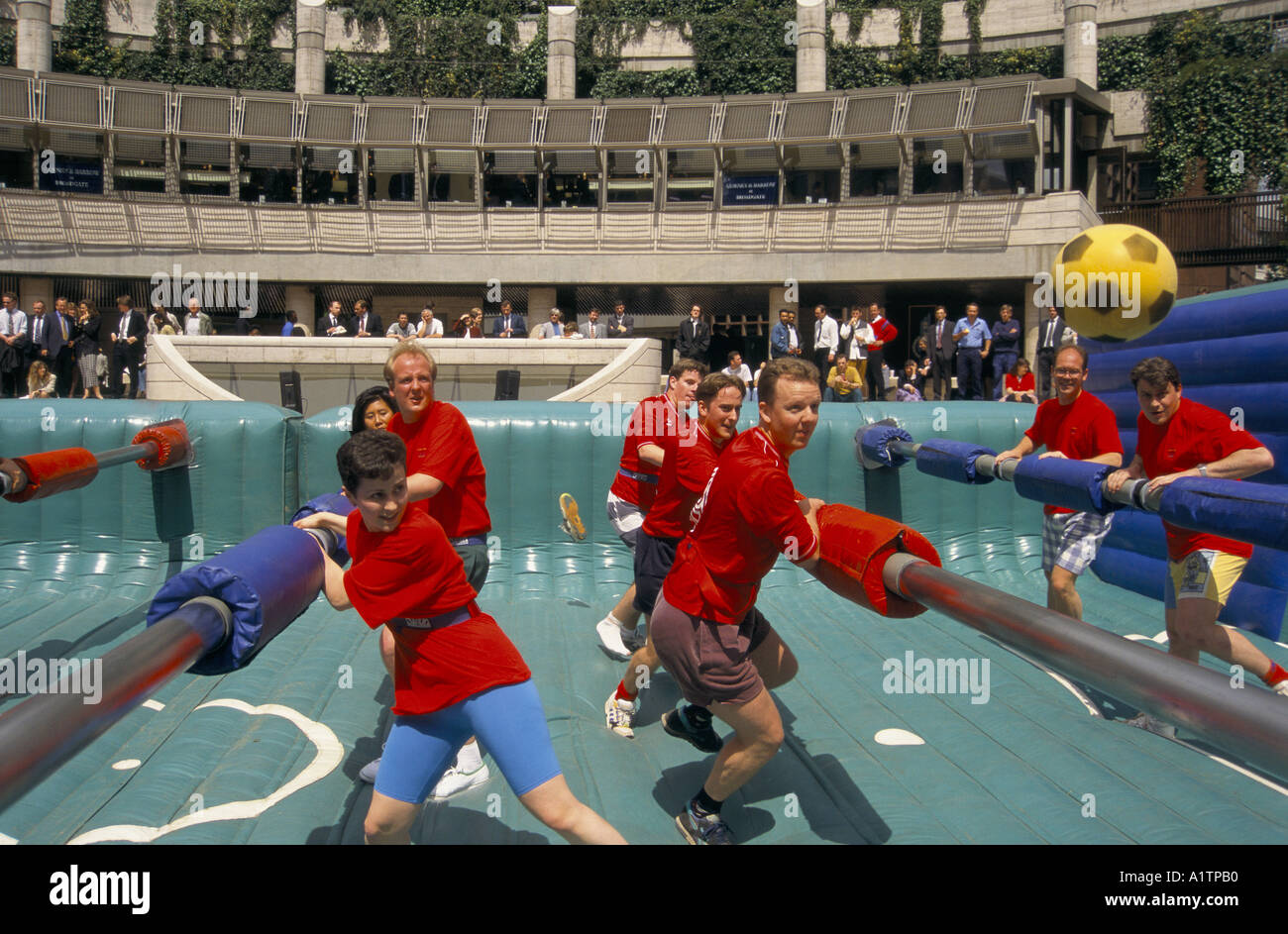 A HUMAN TABLE FOOTBALL AT LUNCHTIME IN THE CITY LONDON JUNE 1995 Stock ...