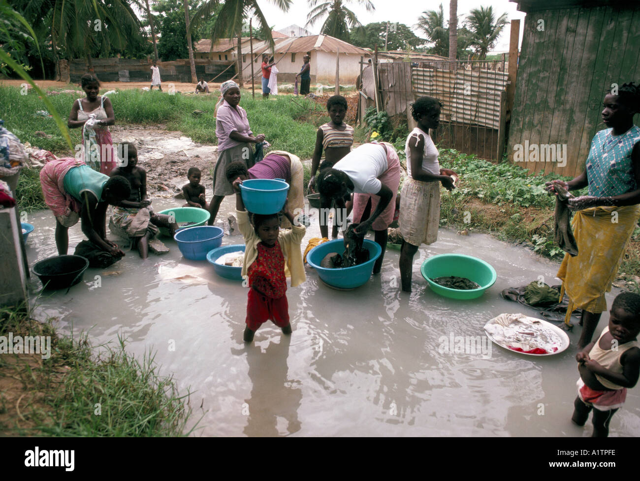 WOMEN AND CHILDREN WASHING CLOTHES IN LUANDA ANGOLA 1987 Stock Photo ...