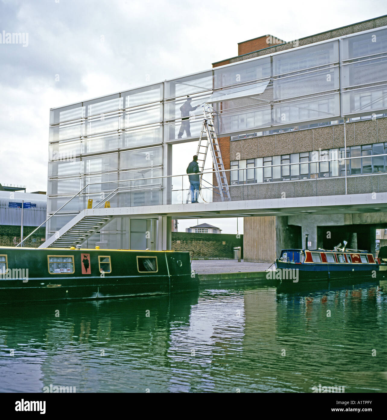 Window cleaners cleaning windows inside a new modern Paddington Basin ...