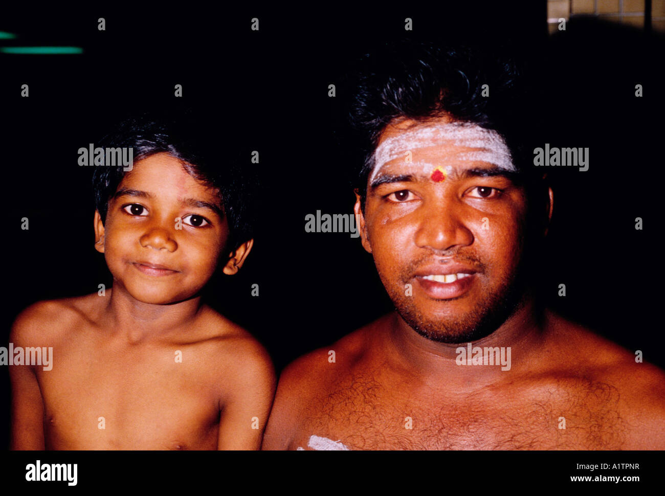 Indian priest, father and son, eye contact, front view, portrait, Sri ...