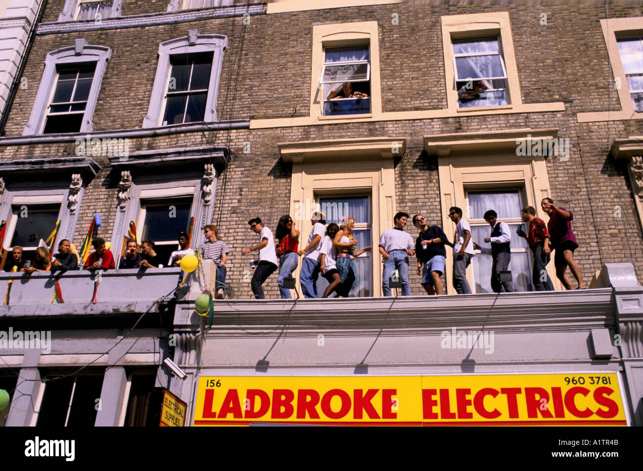 STREET SCENE. NOTTING HILL CARNIVAL LONDON 1989 .Revellers dance on ...