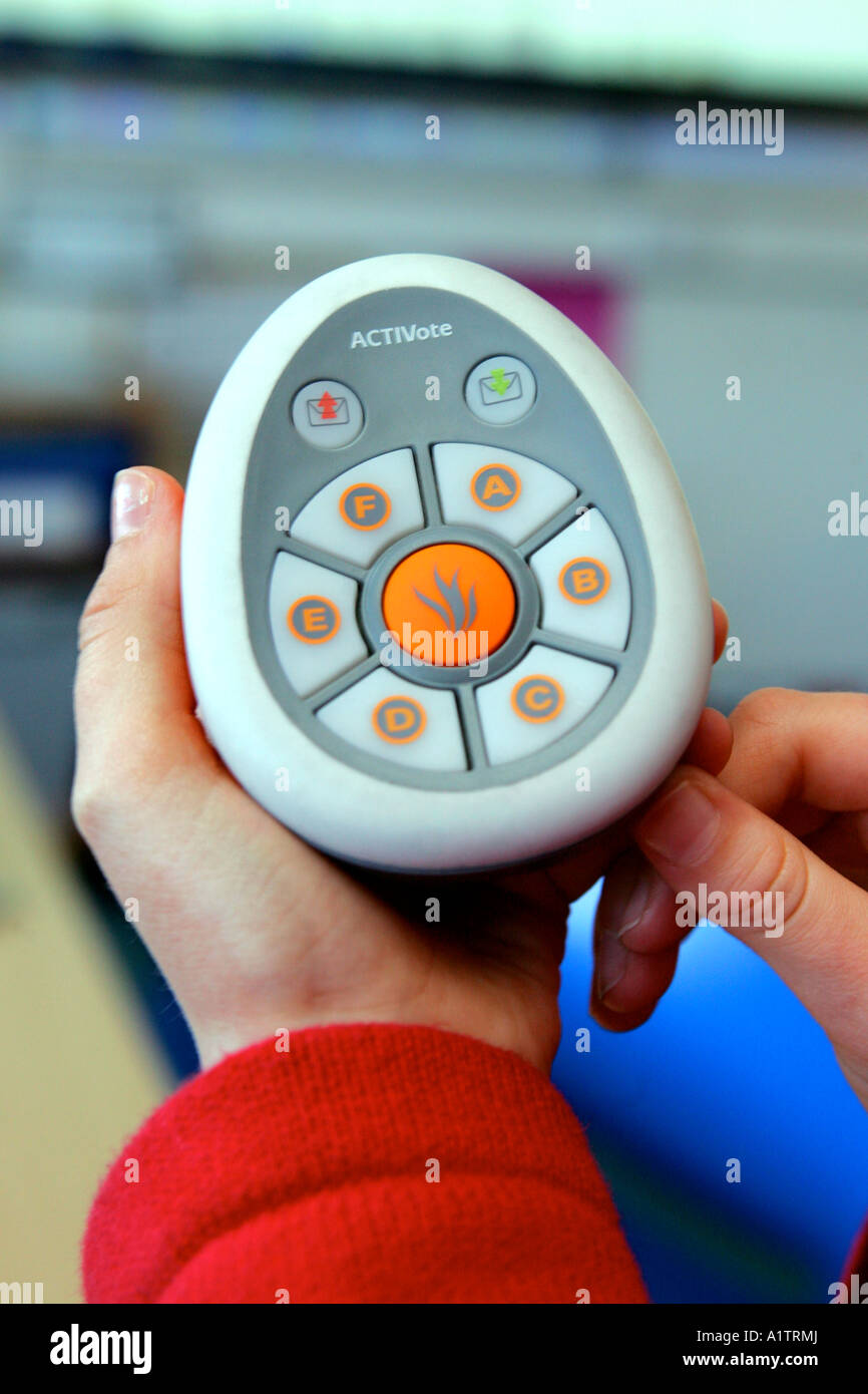 Children using voting pads in a school classroom Stock Photo - Alamy