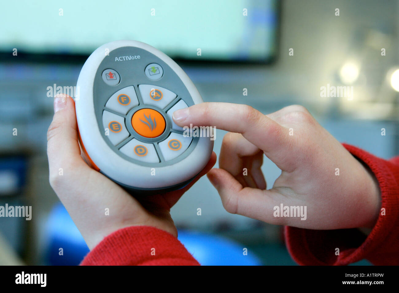 Children using voting pads in a school classroom Stock Photo - Alamy