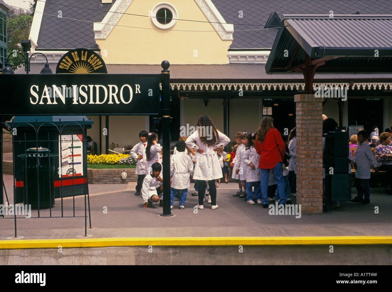 schoolchildren waiting for train, train station, Tren de la Costa, San ...