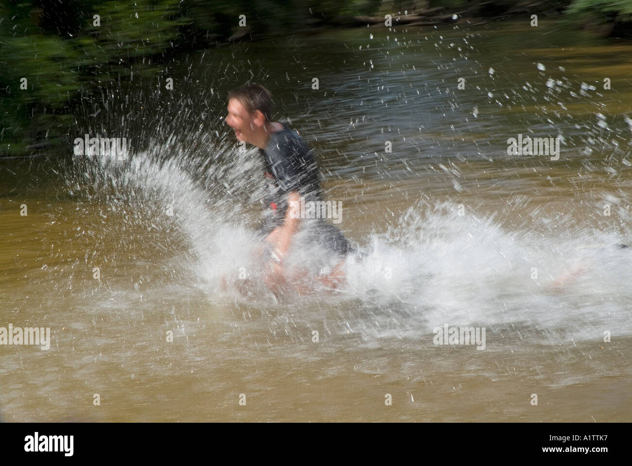 Playing in water streams hi-res stock photography and images - Alamy