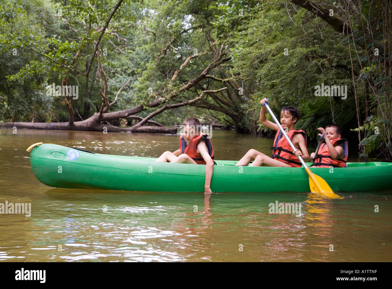 Three boys in canoe on hi-res stock photography and images - Alamy