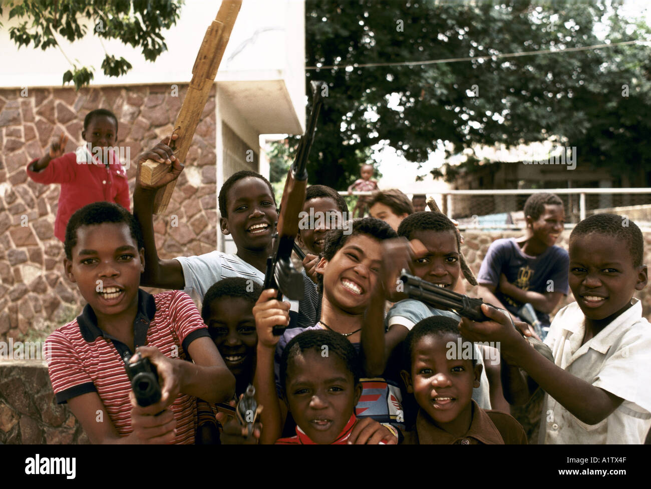MOZAMBIQUE MAPUTO BOYS PLAYING WITH TOY GUNS Stock Photo - Alamy