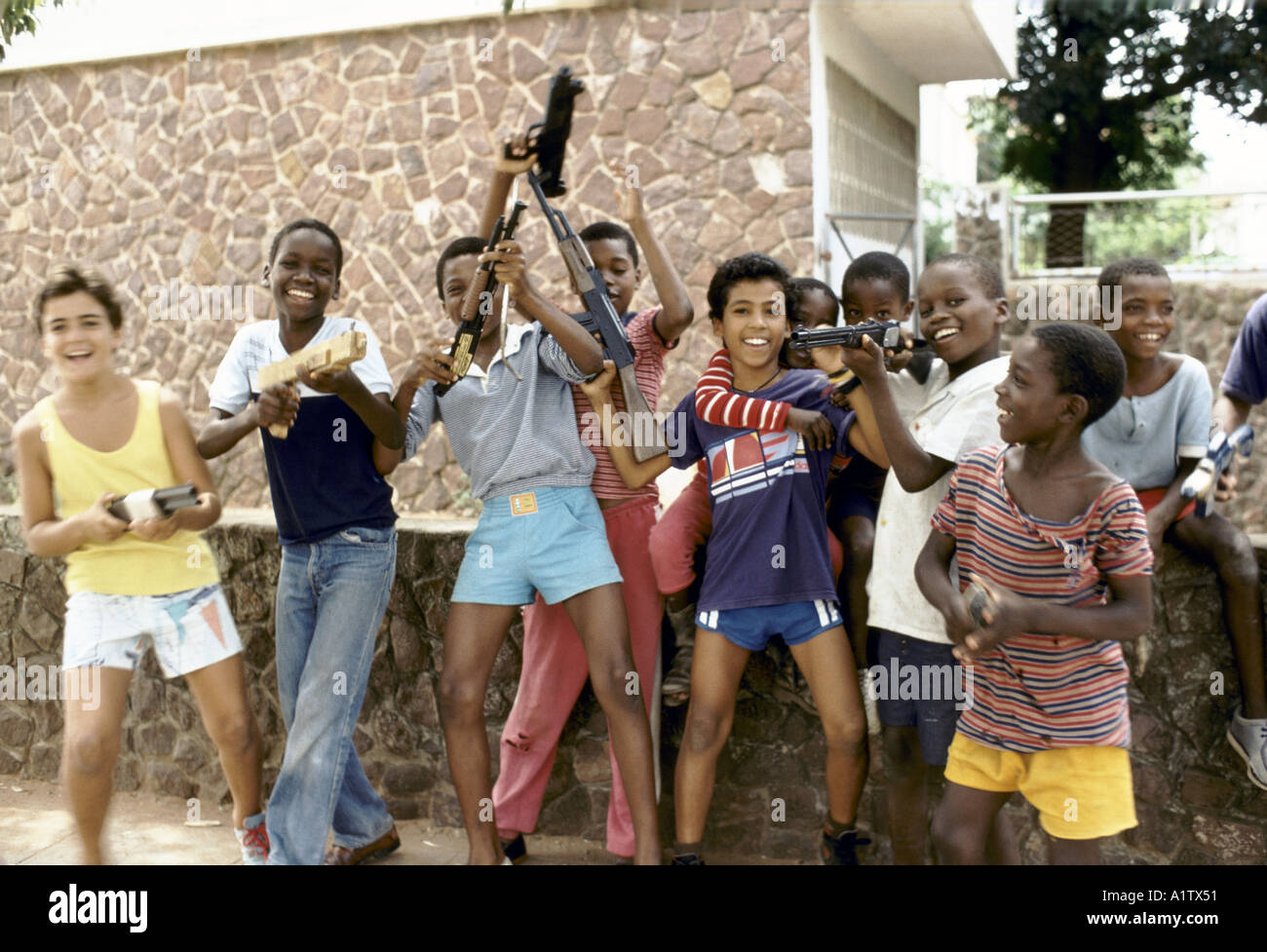 MOZAMBIQUE MAPUTO BOYS PLAYING WITH TOY GUNS Stock Photo - Alamy