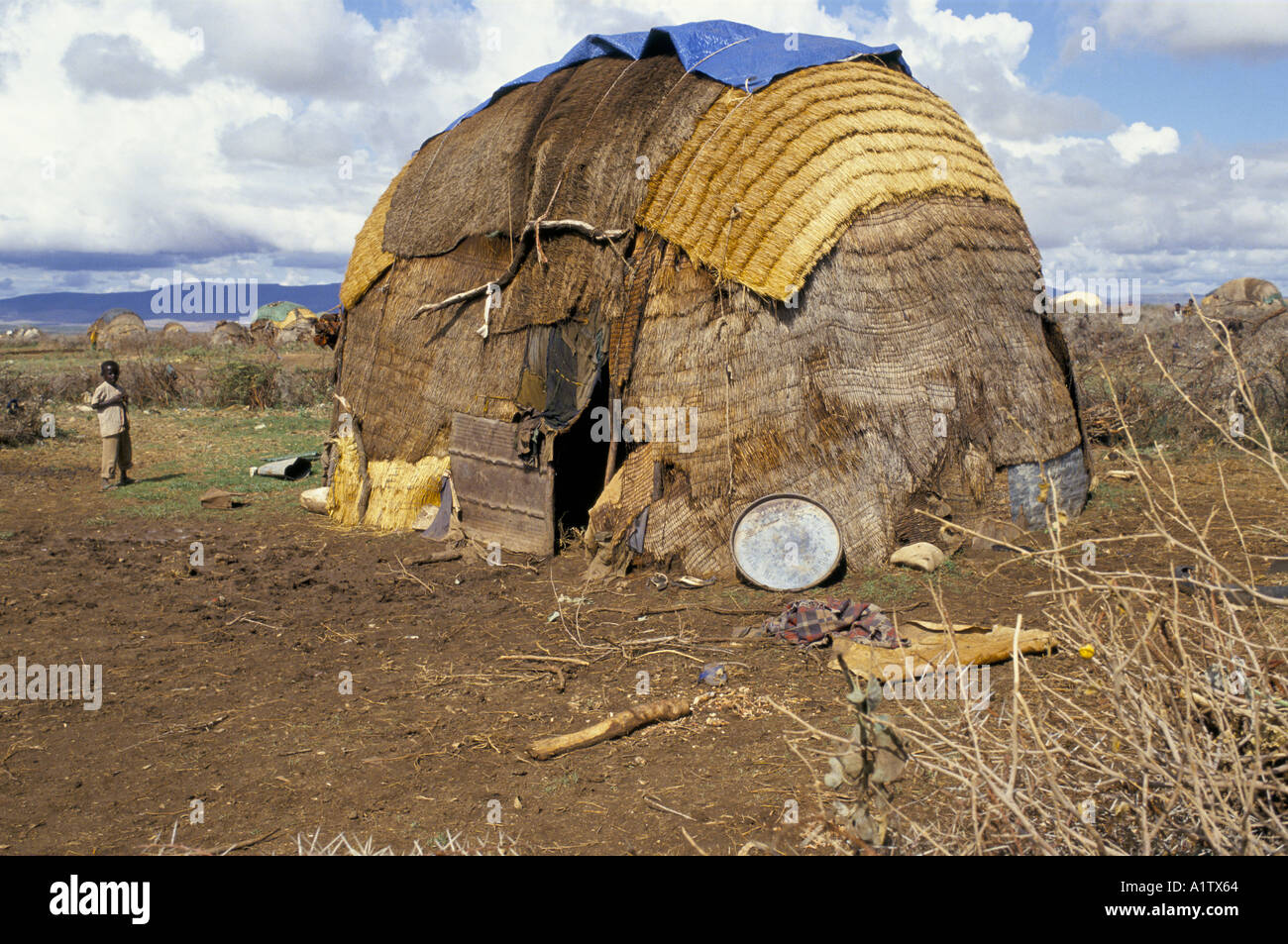 ETHIOPIA JIJIGA. Child standing next to home of SomaliI refugees made ...