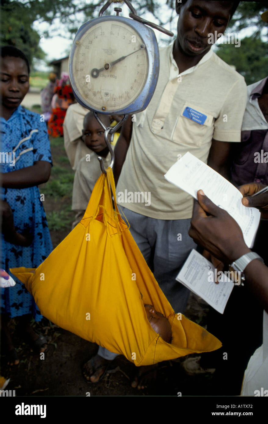 Baby weighing mother scales hi-res stock photography and images - Alamy