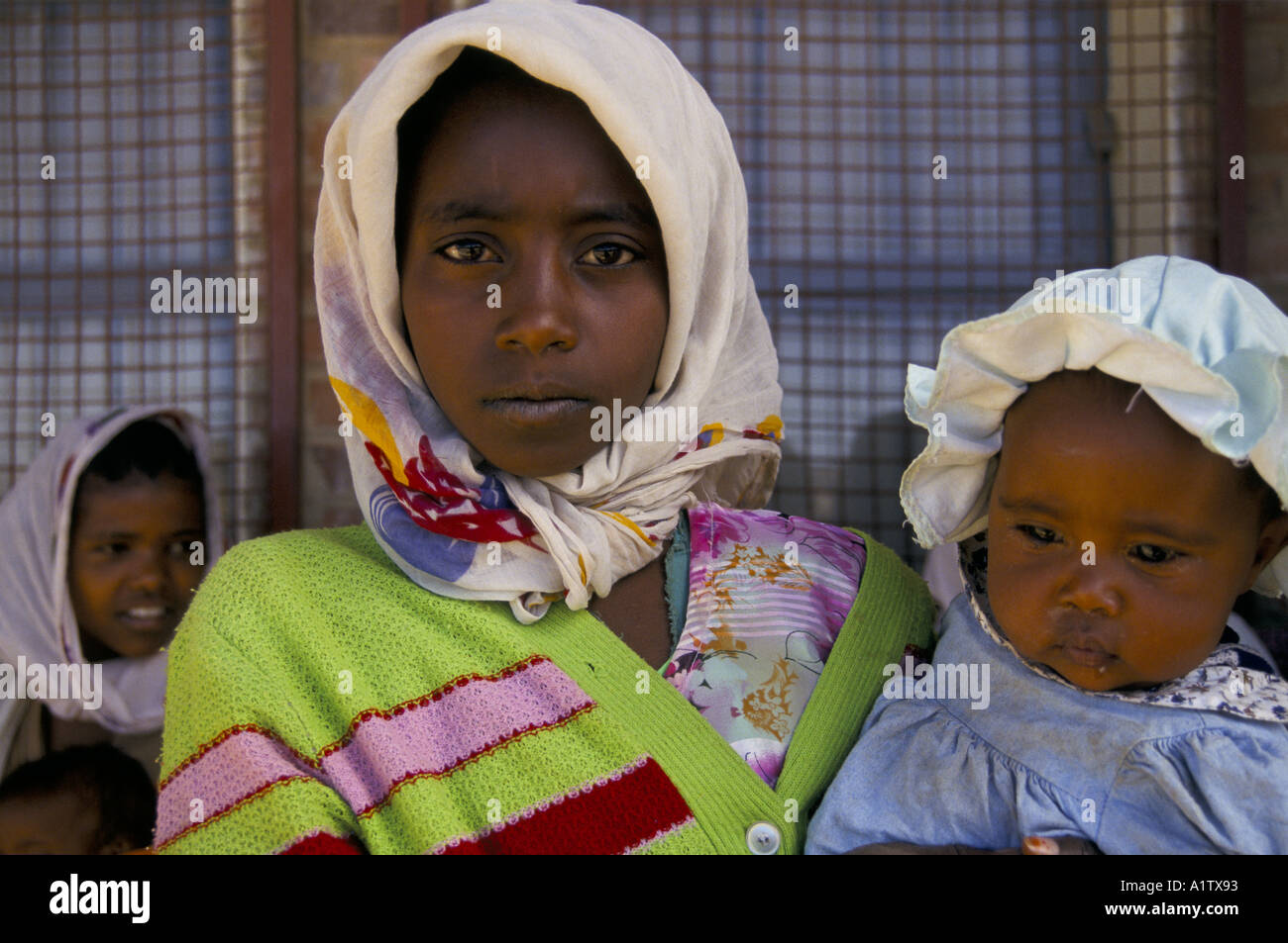 WOMEN HOLDING BABY WAITING AT CLINIC ERITREA MAY 1993 Stock Photo - Alamy