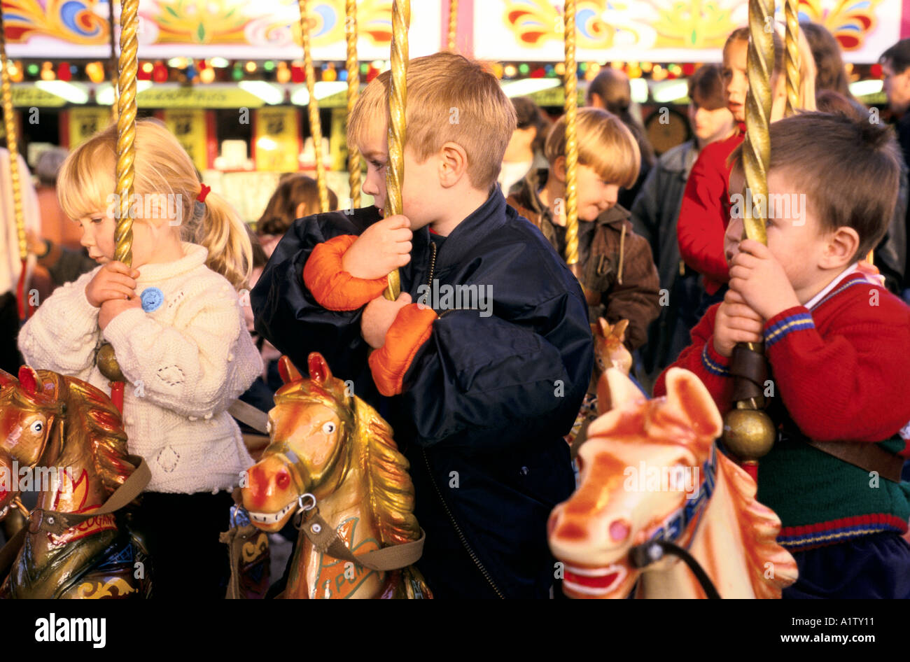 FAIRGROUNDS NOTTINGHAM GOOSE FAIR 1996.Young children riding on ...