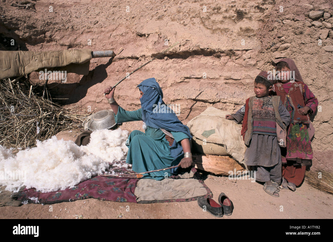 AFGHANISTAN BAMYAN. HAZARA WOMAN PREPARES WOOL USUALLY SOLD IN KABUL OR ...