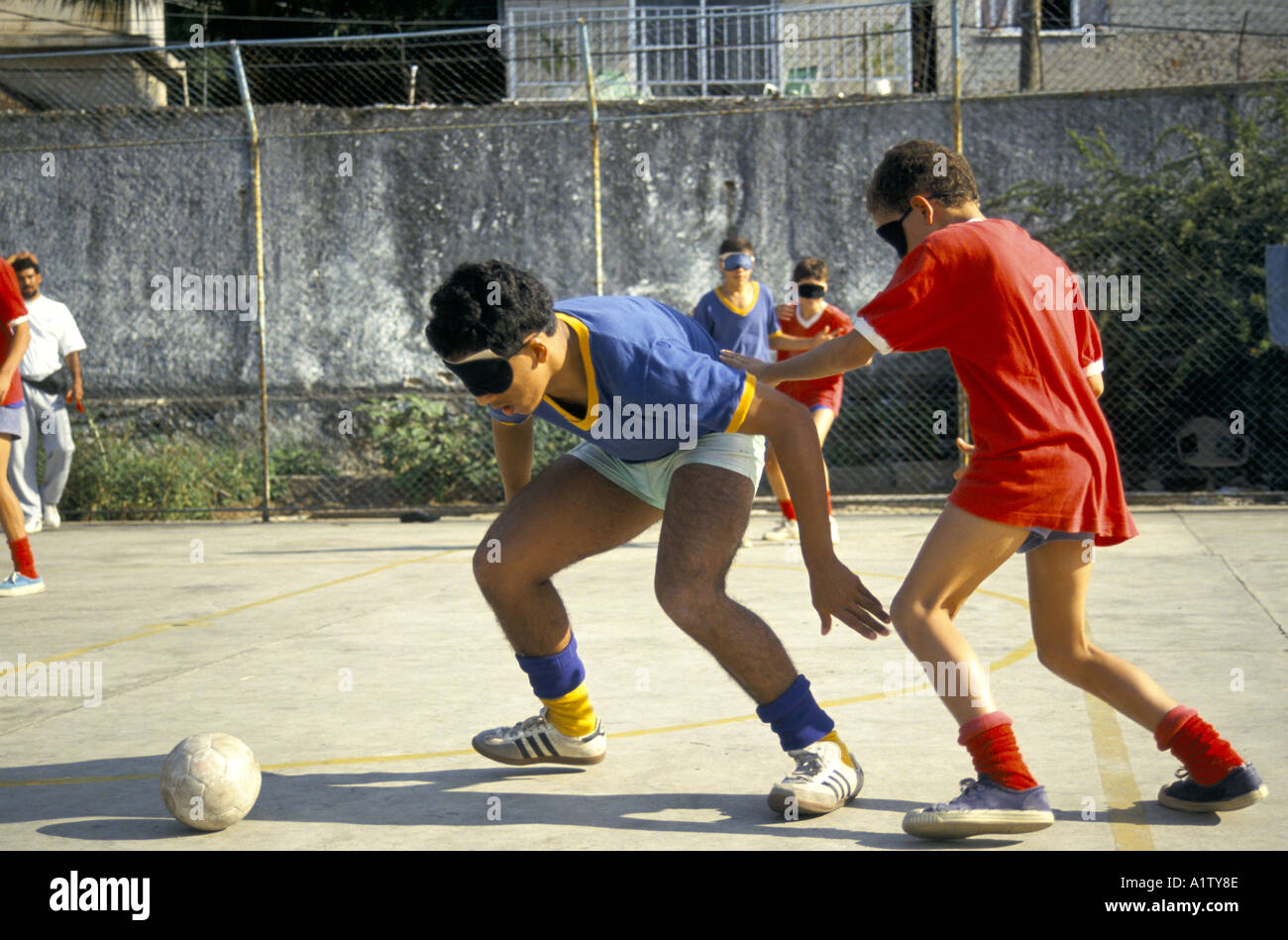 BOYS PLAYING FOOTBALL BRAZIL SOME ARE PARTIALLY SIGHTED SO ALL WEAR ...