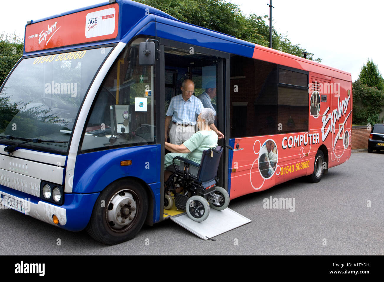 Elderly woman in wheelchair user enter the Computer Explorer Bus to ...