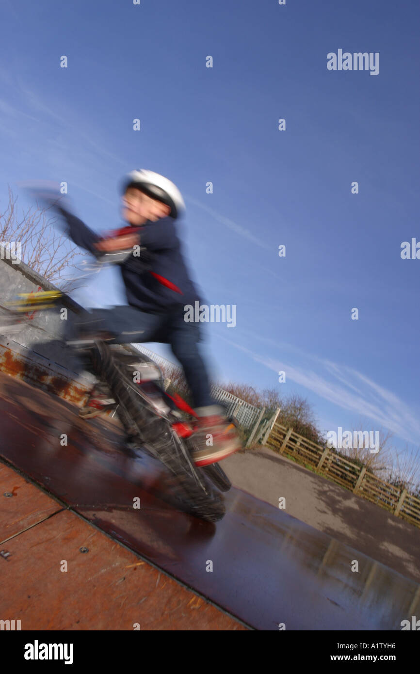 Accident Young child boy falling off a bicycle at BMX bike park on a ...