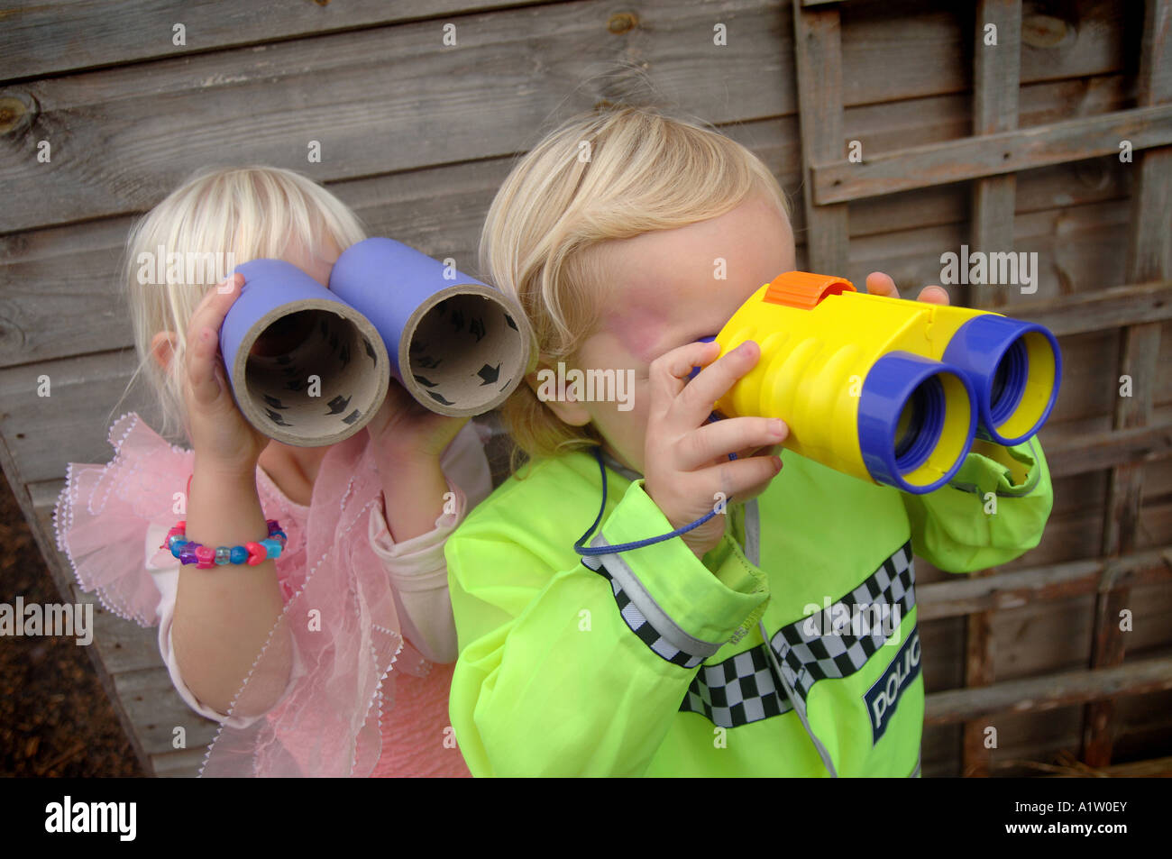 Children looking through and playing with binoculars Stock Photo - Alamy