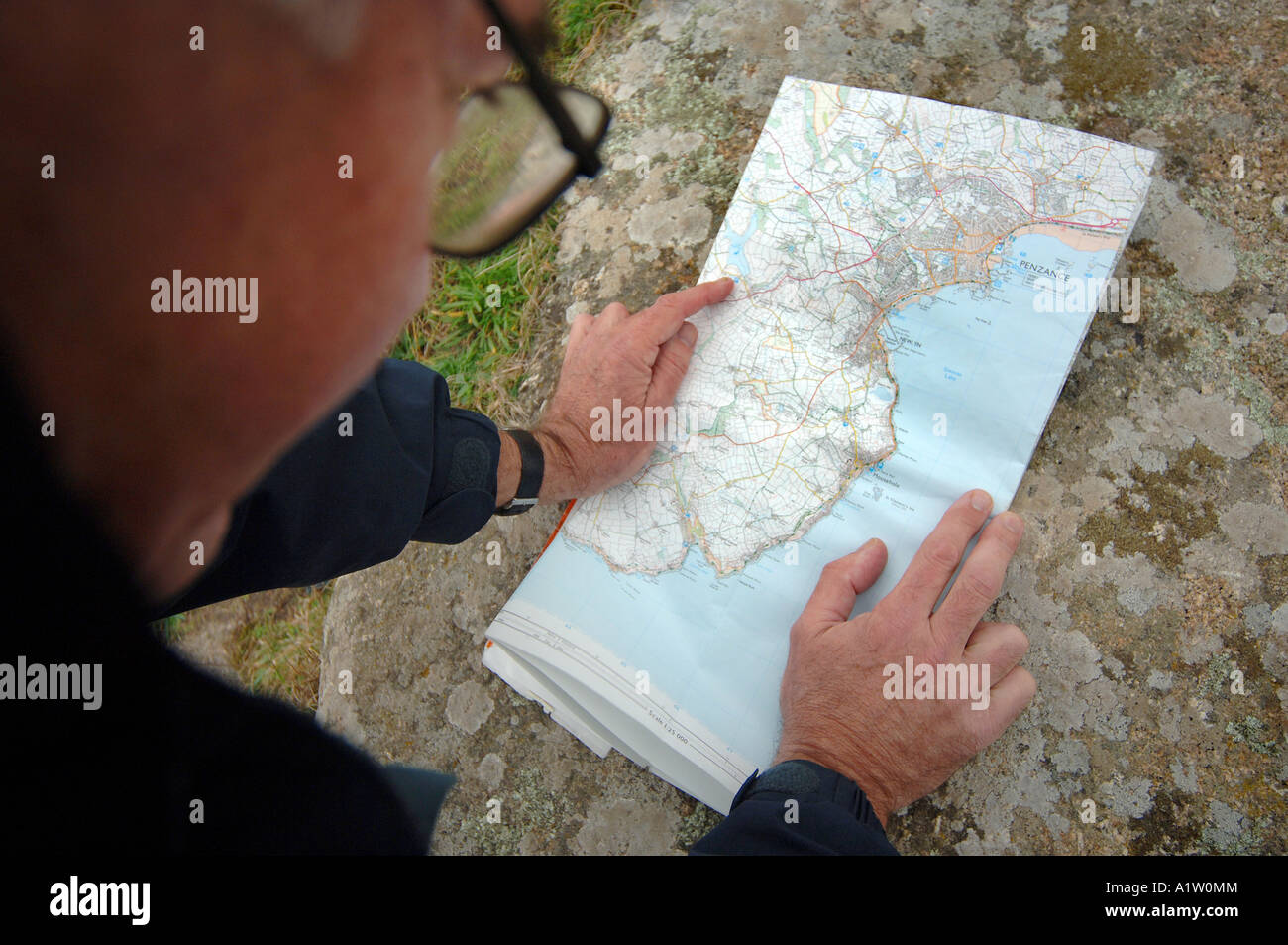 Reading a map on a walk from Mousehole to Lamorna Cove in Cornwall ...