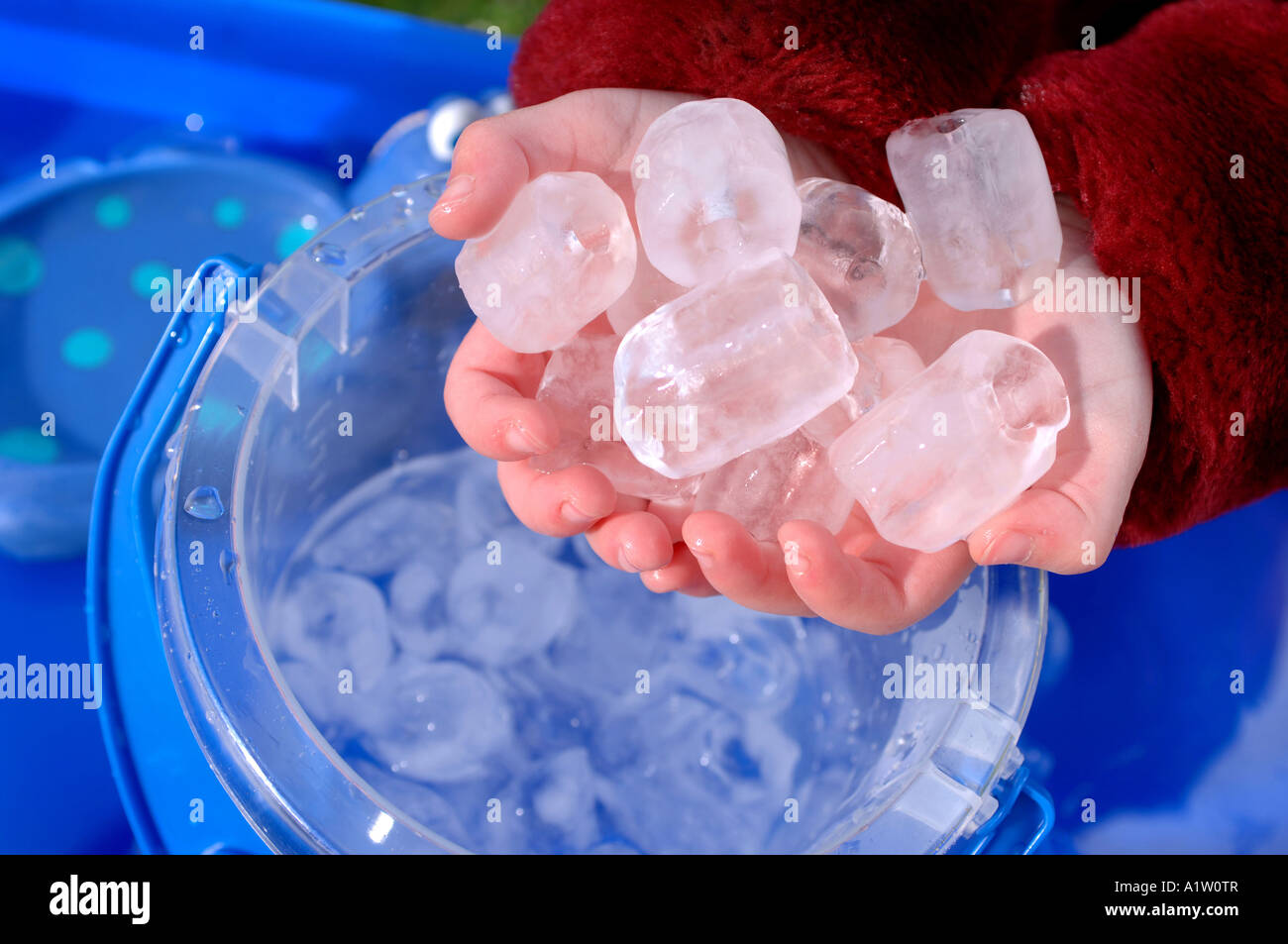 Child holding ice cubes hi-res stock photography and images - Alamy