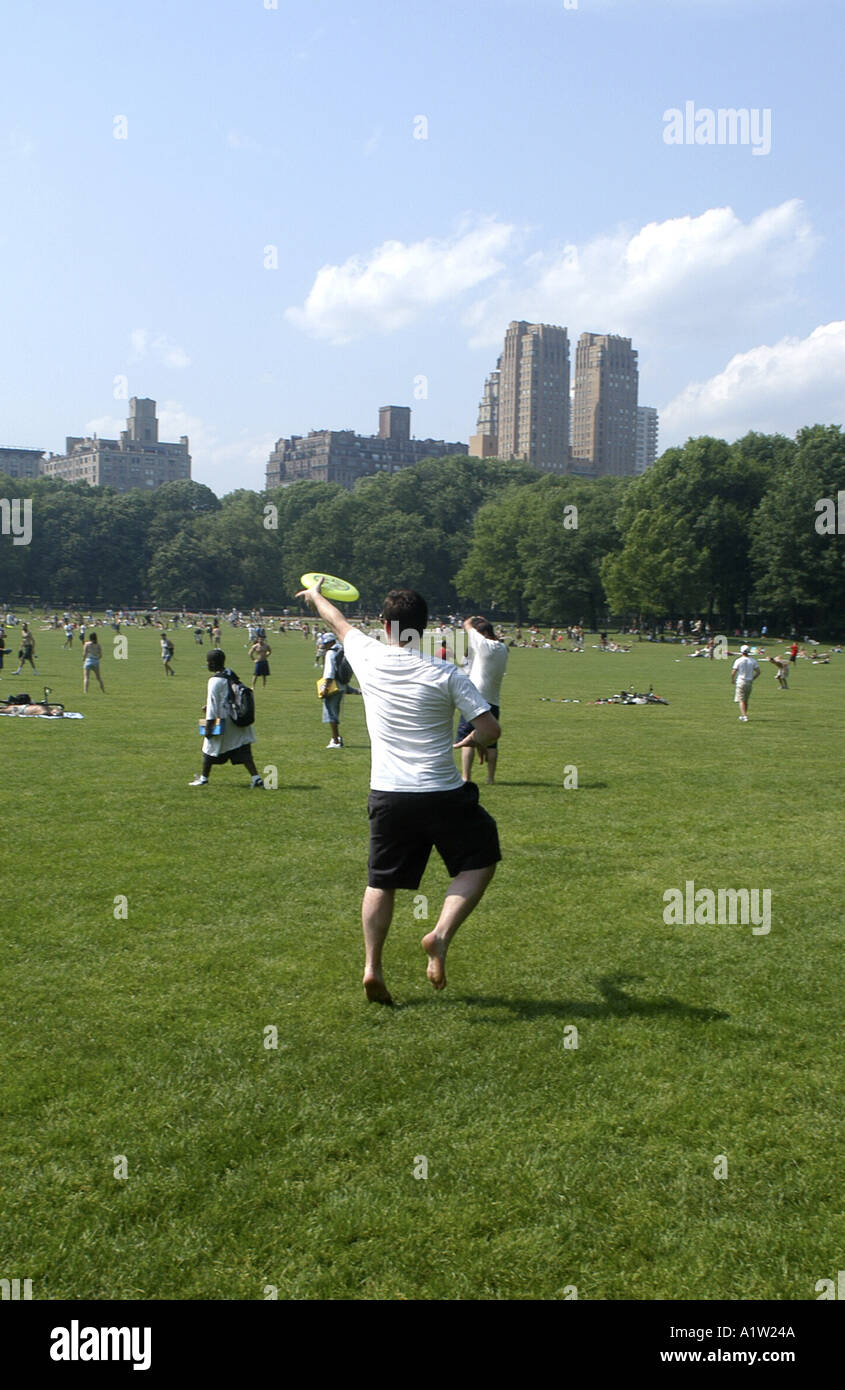 Young man playing with a frisbee in Central Park Manhattan New York ...