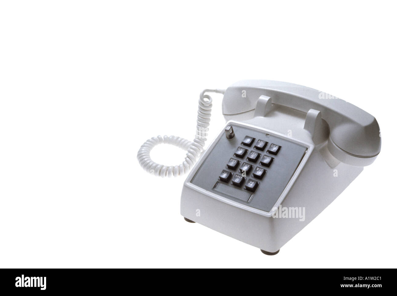 White touch tone telephone silhouetted on white background Stock Photo ...