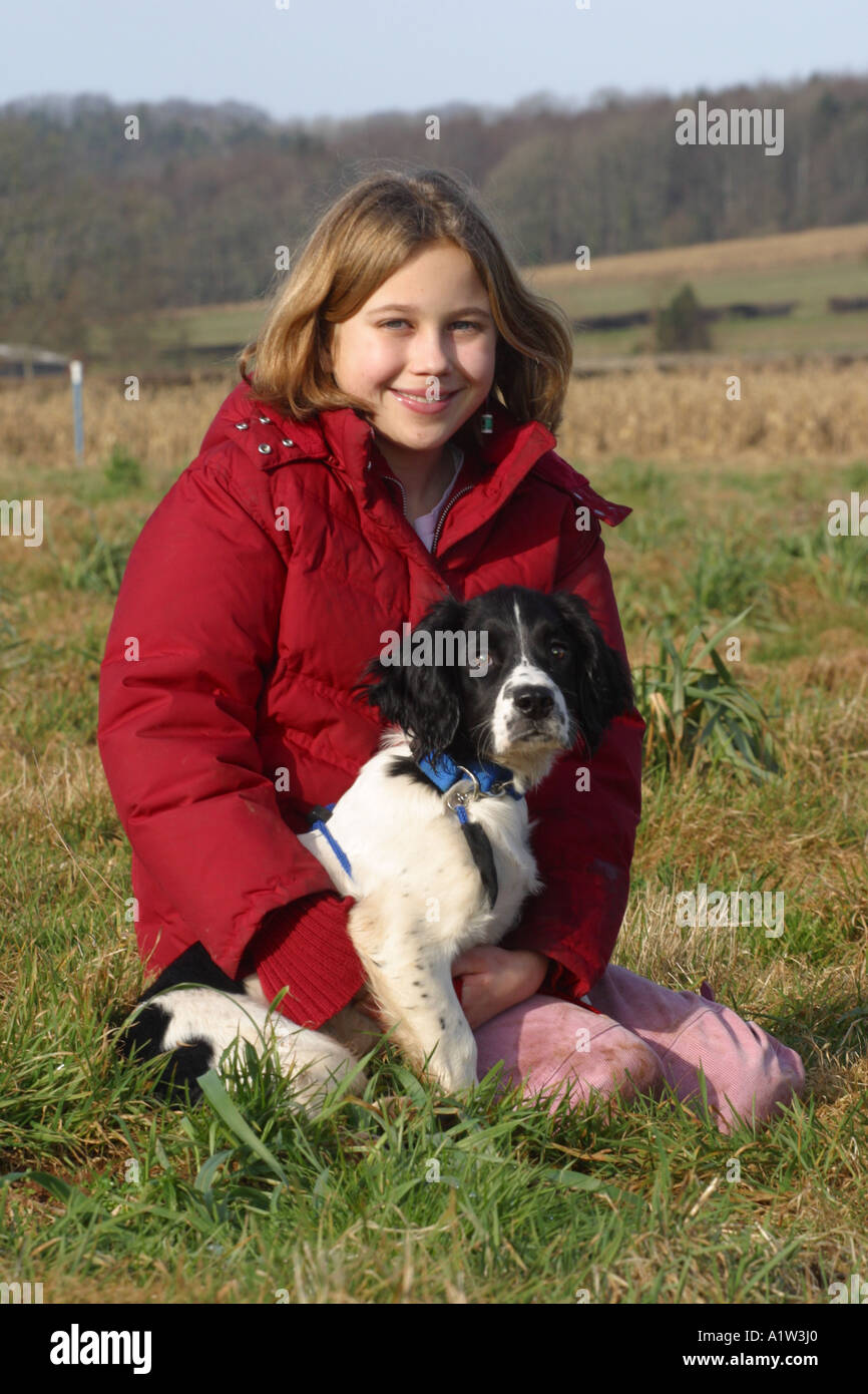 Young girl and puppy dog Stock Photo - Alamy