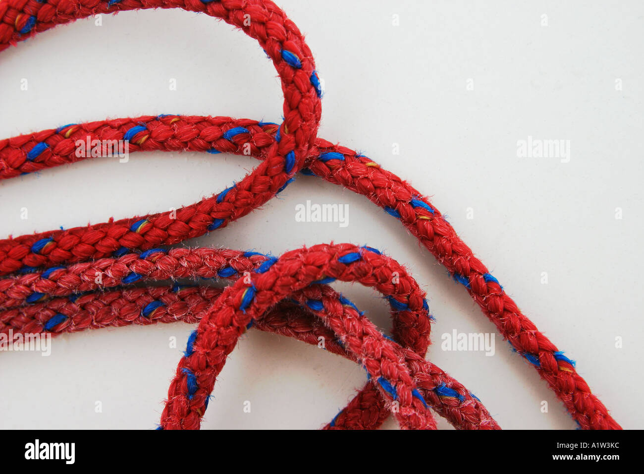 Red tangled rope Stock Photo - Alamy