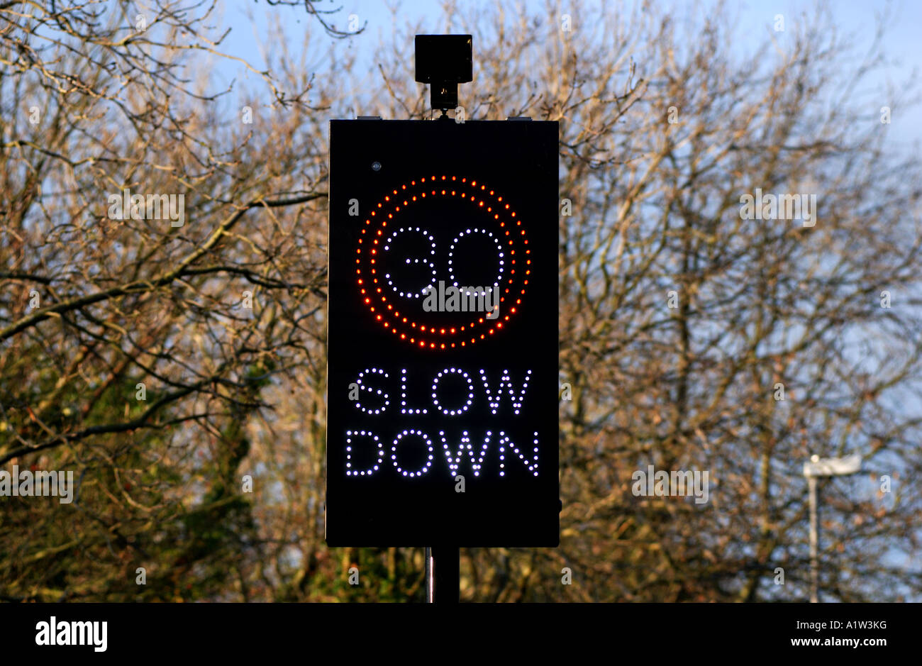 Automatic 30 SLOW DOWN road sign, UK Stock Photo - Alamy