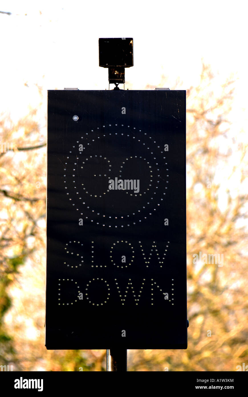 Unlit automatic 30 SLOW DOWN road sign, UK Stock Photo - Alamy