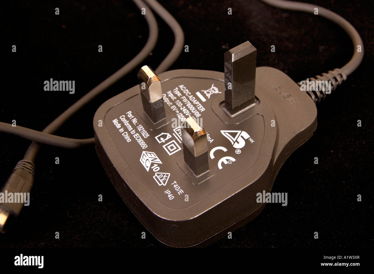 A power adapter charger configured for use in the UK with a 3 pin ...