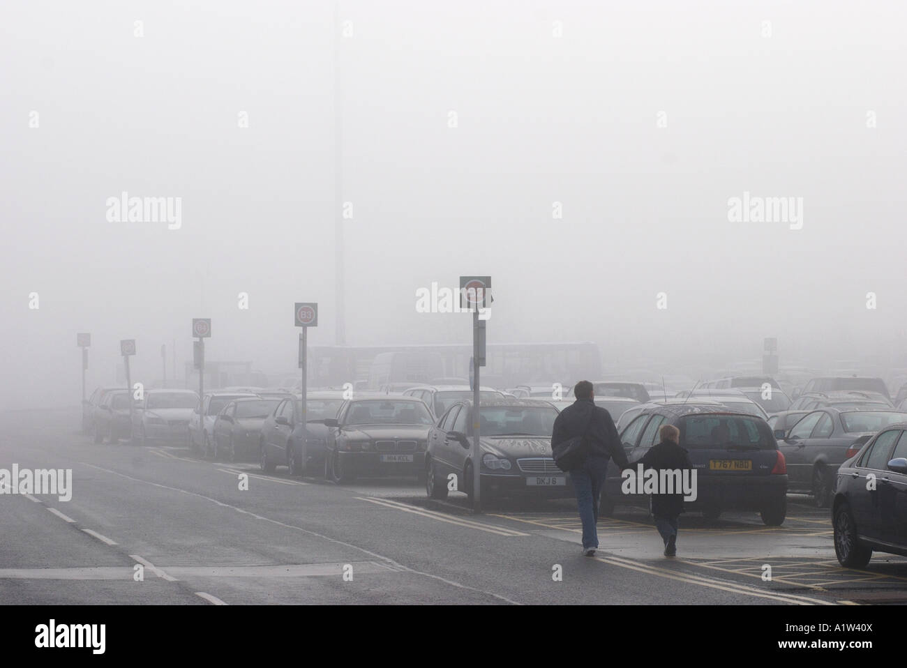 Car park in winter fog at Birmingham International Airport, West ...