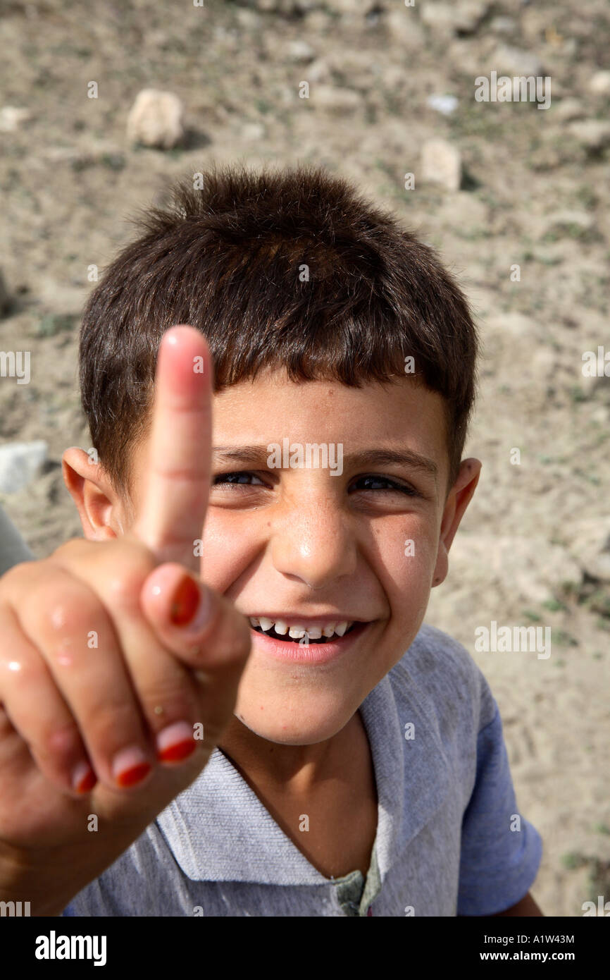 Kurdish boy holding index finger up. Catakkopru, Eastern Turkey Stock Photo - Alamy
