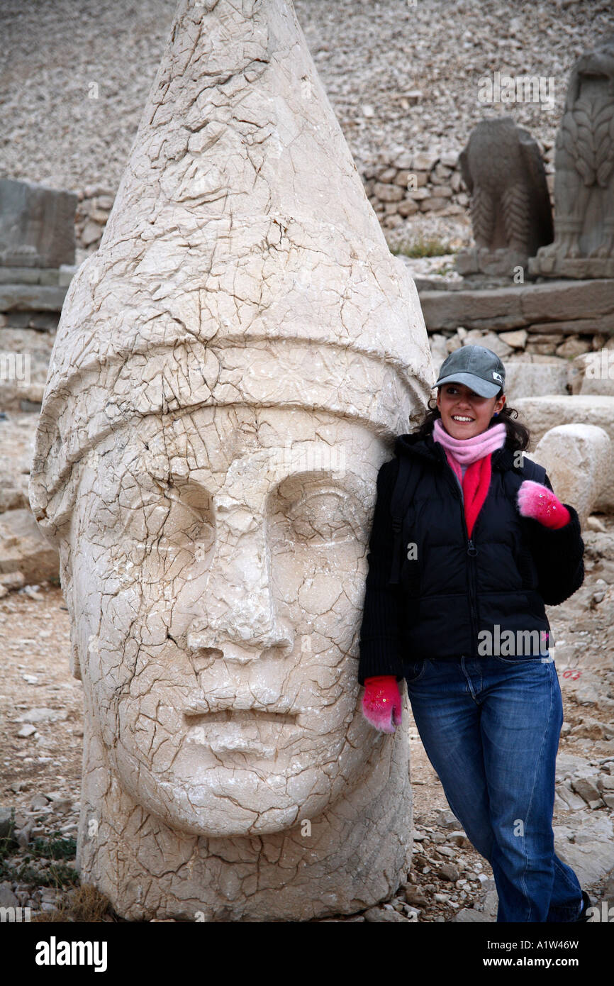 Female tourist and statue head at Mount Nemrut, Anatolia, Turkey Stock ...