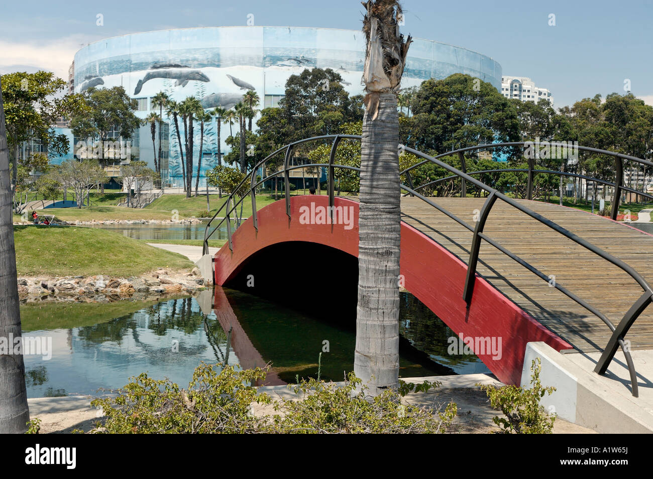 Pedestrian bridge in Rainbow Lagoon Park with Long Beach Arena in ...
