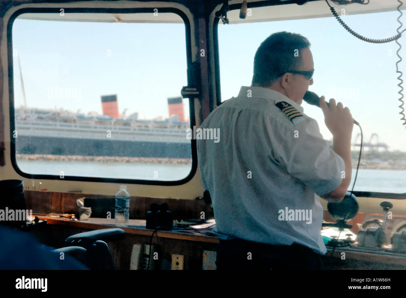 Boat captain narrates harbor cruise with Queen Mary in background Long ...