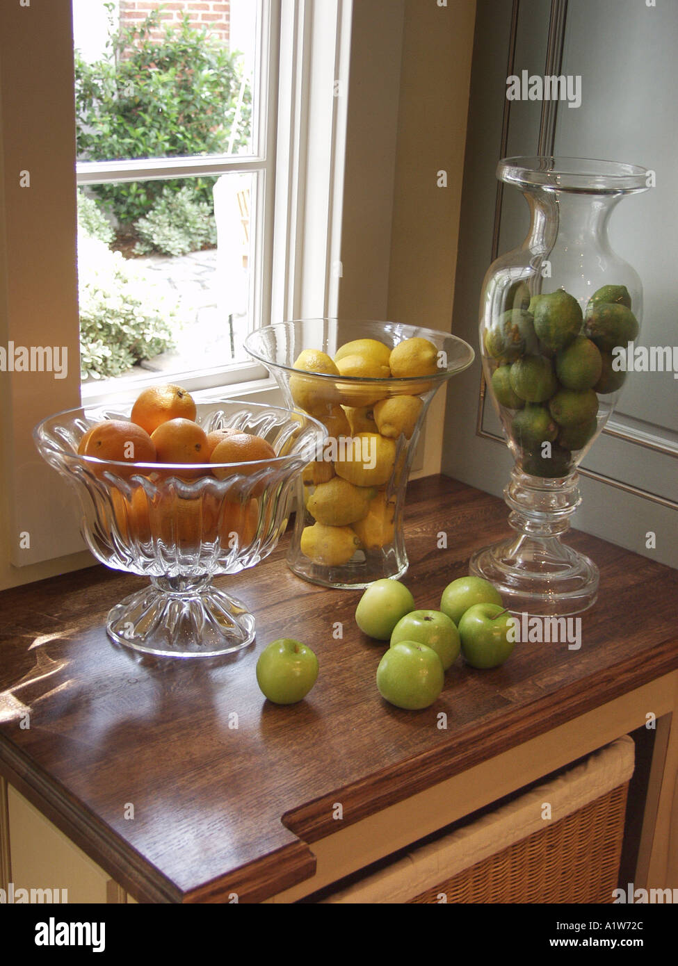 pantry window with decorative glass containers with citrus fruit Stock ...