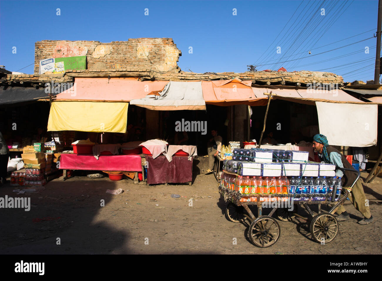AFGHANISTAN Central Kabul Shor Bazaar Man pushing trolley laden with ...