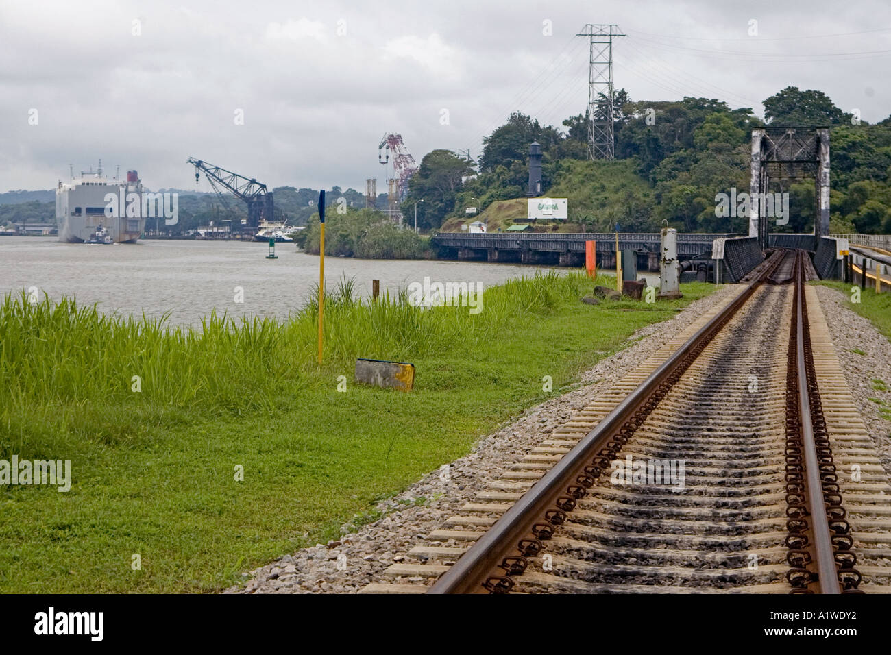 Panama Canal Railway along Panama Canal with cargo ship on canal Stock ...