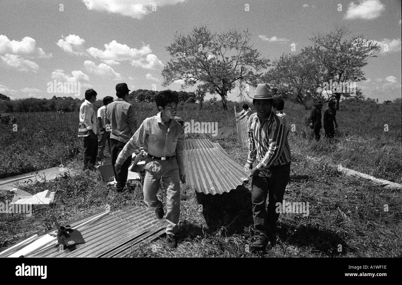 Returning Guatemalan refugees getting materials to start constructing a ...