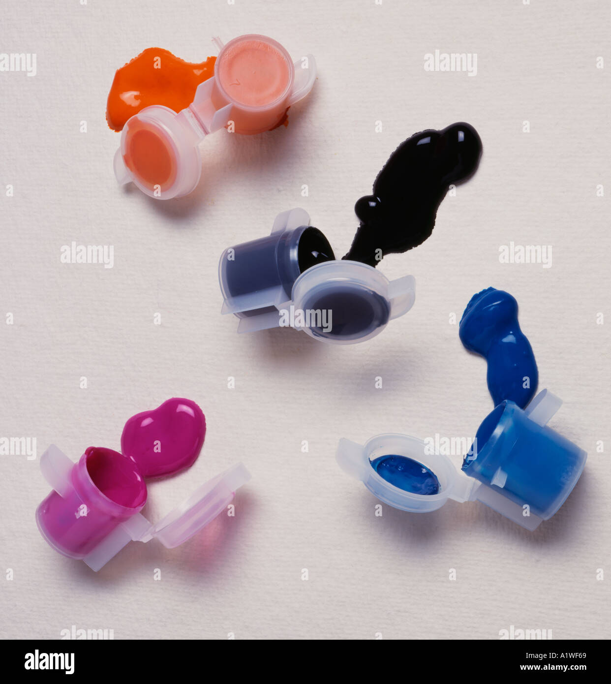 four spilt paint pots CMYK Stock Photo - Alamy