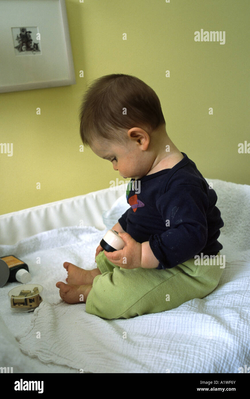 Baby boy sitting up Stock Photo - Alamy