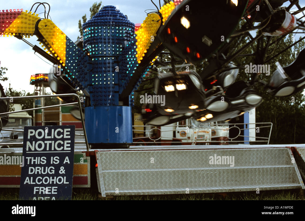 Warning sign on a fairground ride Stock Photo - Alamy