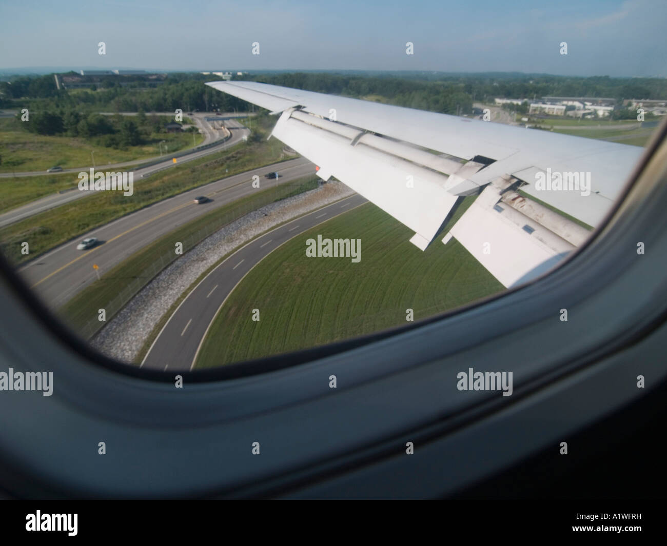 Airplane landing window view hi-res stock photography and images - Alamy