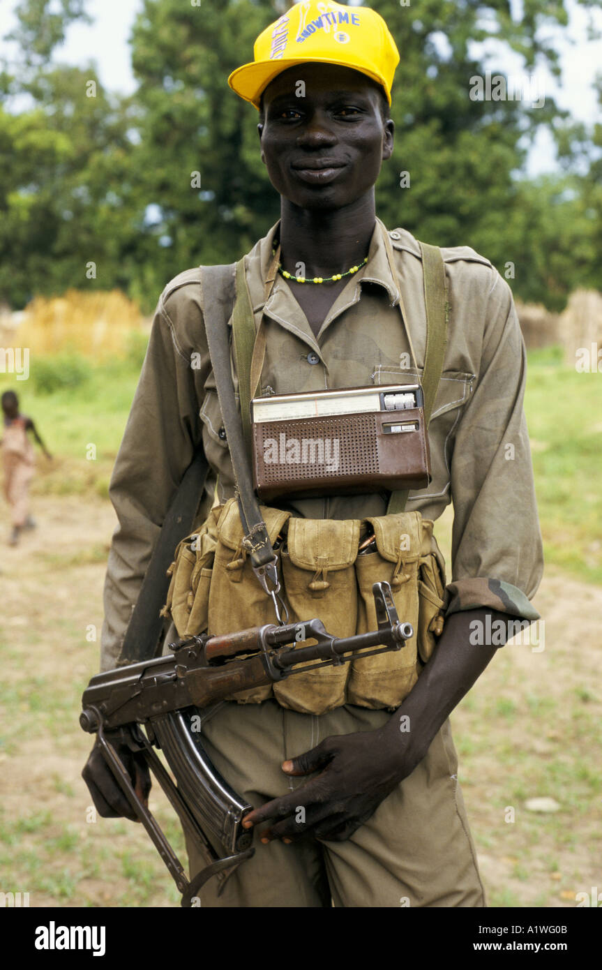 SPLA SOLDIER WEARING COMBAT UNIFORM CARRYING TRANSISTOR RADIO AK47 ...
