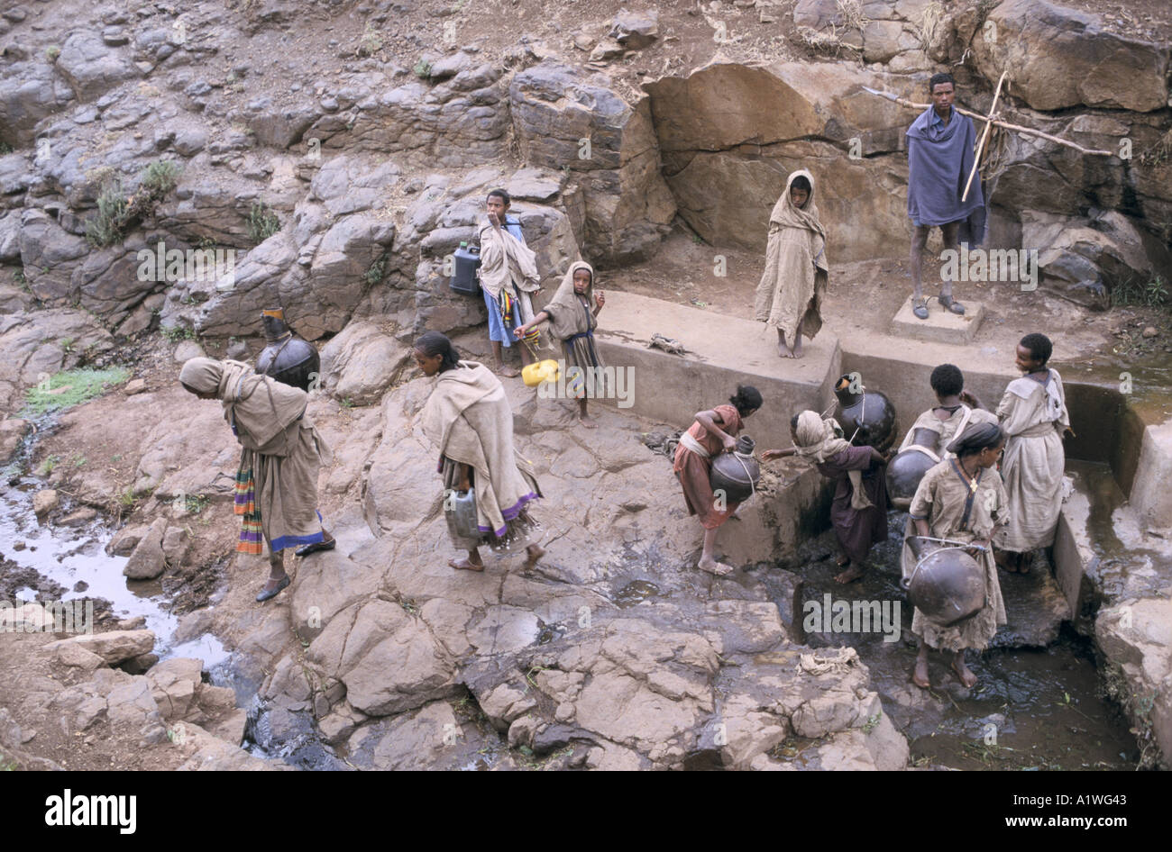 LARGE GROUP OF WOMEN COLLECTING WATER FROM A SPRING. ETHIOPIA 1998 ...