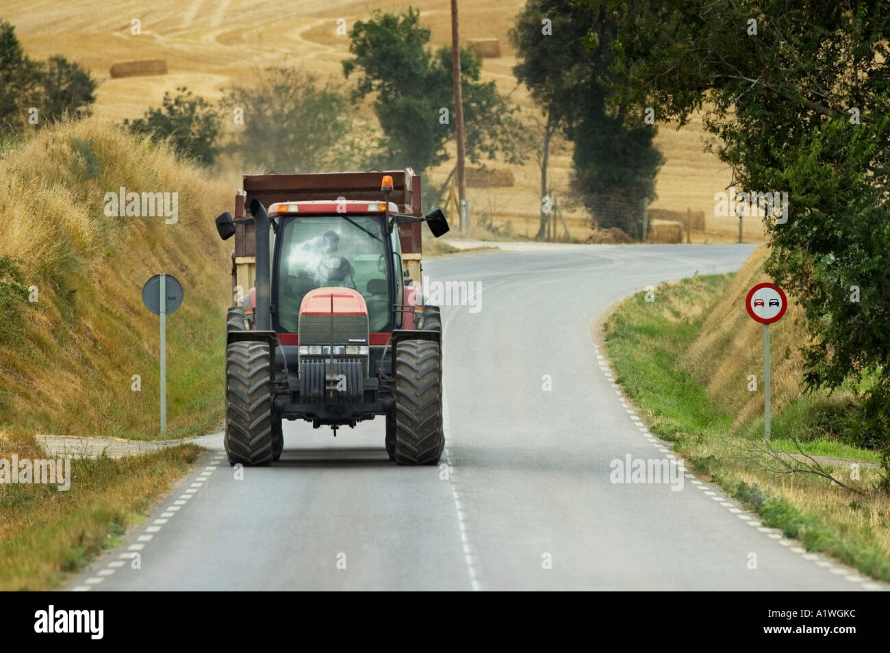 TRACTOR ON A ROAD Stock Photo - Alamy