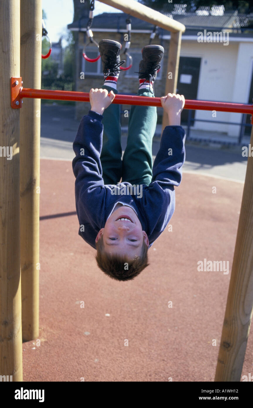 CHILD PLAYING ON BARS, CLISSOLD PARK LONDON 1997 1990 Stock Photo - Alamy
