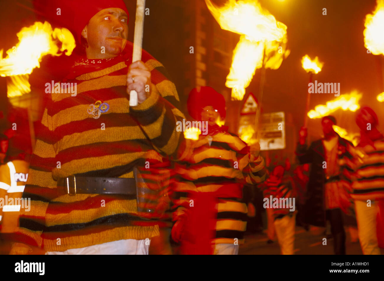 REVELLERS TAKE PART IN PROCESSION WITH BURNING TORCHES